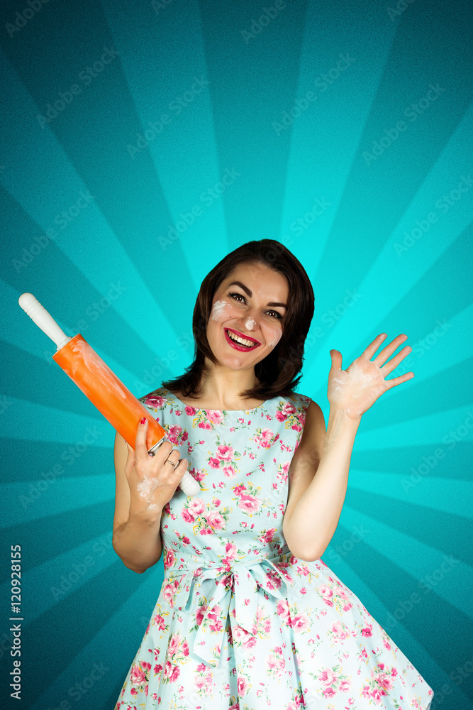 Beauty smiling pin-up girl with rolling-pin.on blue background Stock ...