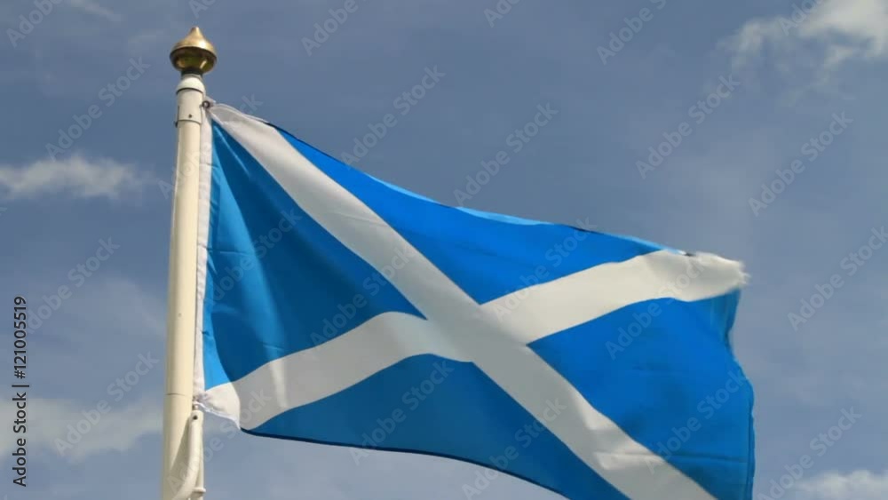 Scottish flag blowing in wind with blue sky Stock Video | Adobe Stock