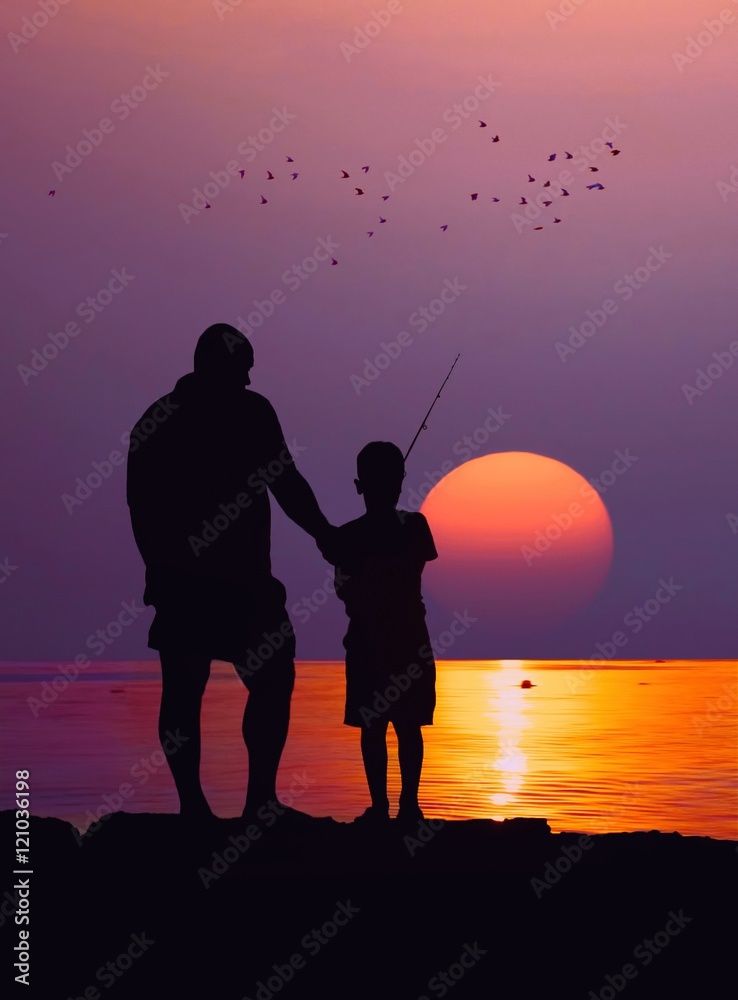 Silhouettes of fishermen, a father and son on a background of the ...