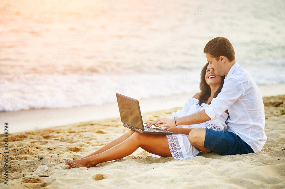 Beautiful romantic couple relaxing on the beach . By browsing on the ...