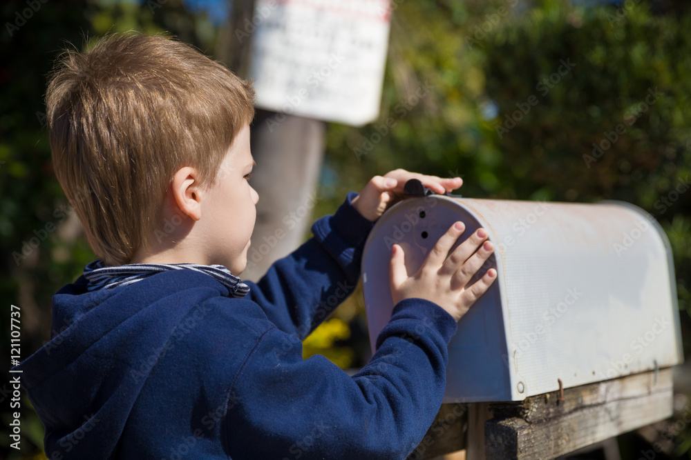 School boy opening a post box and checking mail. Kid waiting for a ...