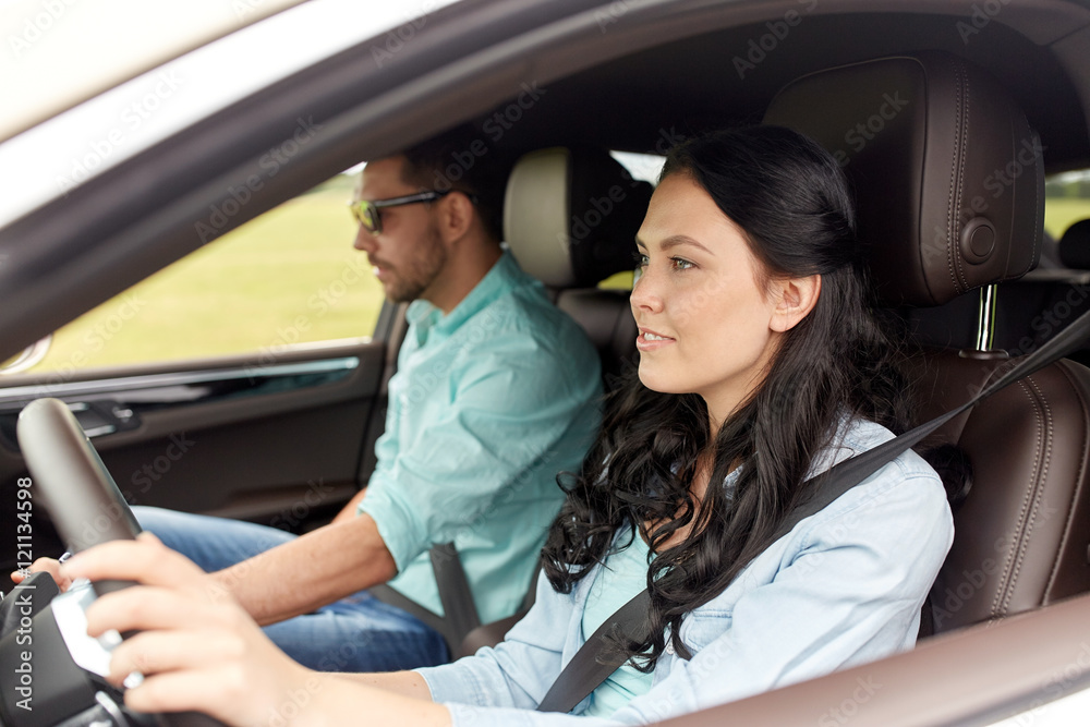 happy man and woman driving in car Stock Photo | Adobe Stock