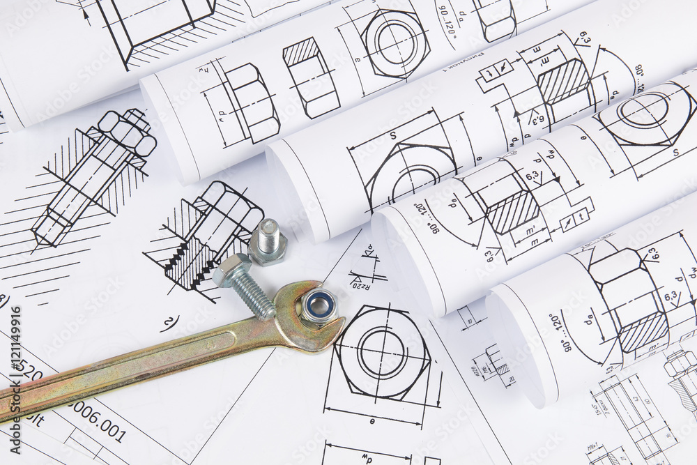 Wrench, bolts and nuts on a background of engineering drawings. Science ...