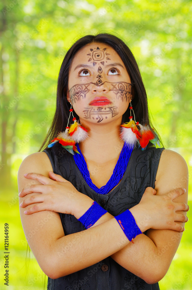 Portrait amazonian exotic woman with facial paint and black dress ...