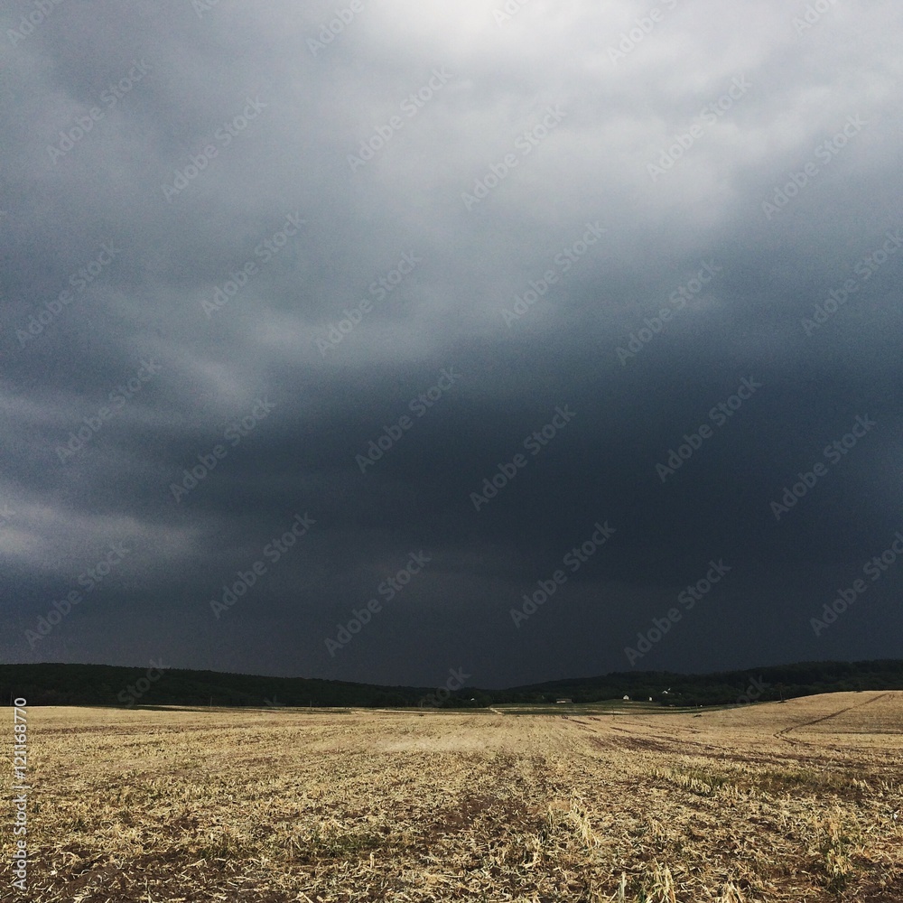 dark clouds and field Stock Photo | Adobe Stock