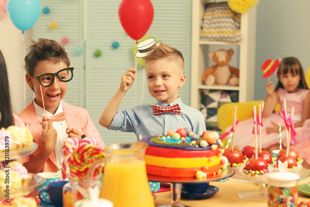 Children's funny birthday party in decorated room Stock Photo | Adobe Stock