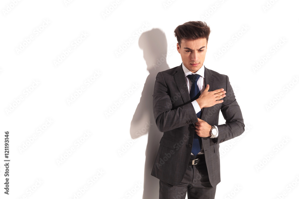 young business man in solemn pose with hand on chest Stock Photo ...