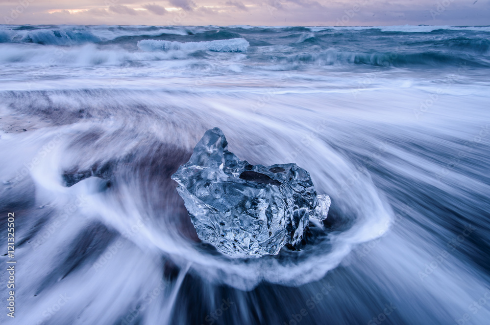 Long Exposure creating flow of ocean tide with iceberg on the famous ...