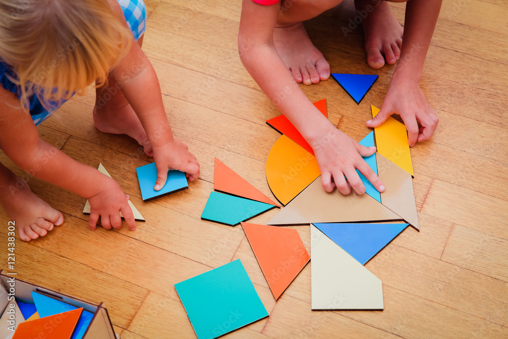 kids learning -little boy and girl playing with geometric shapes Stock ...