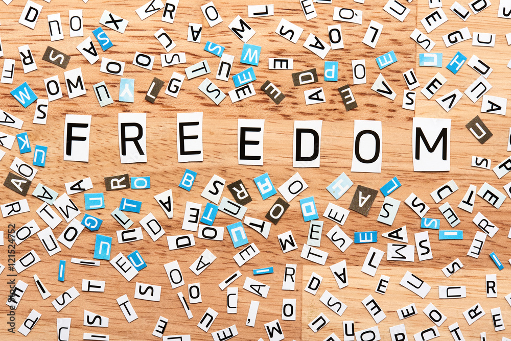 Freedom word from cut out letters Stock Photo | Adobe Stock