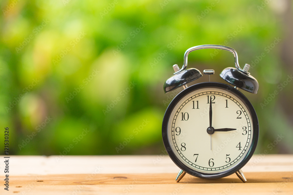 clock on wood table in the green garden time at 3 o'clock Stock Photo ...