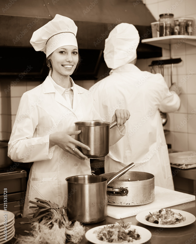 Two cooks at restaurant kitchen Stock-Foto | Adobe Stock