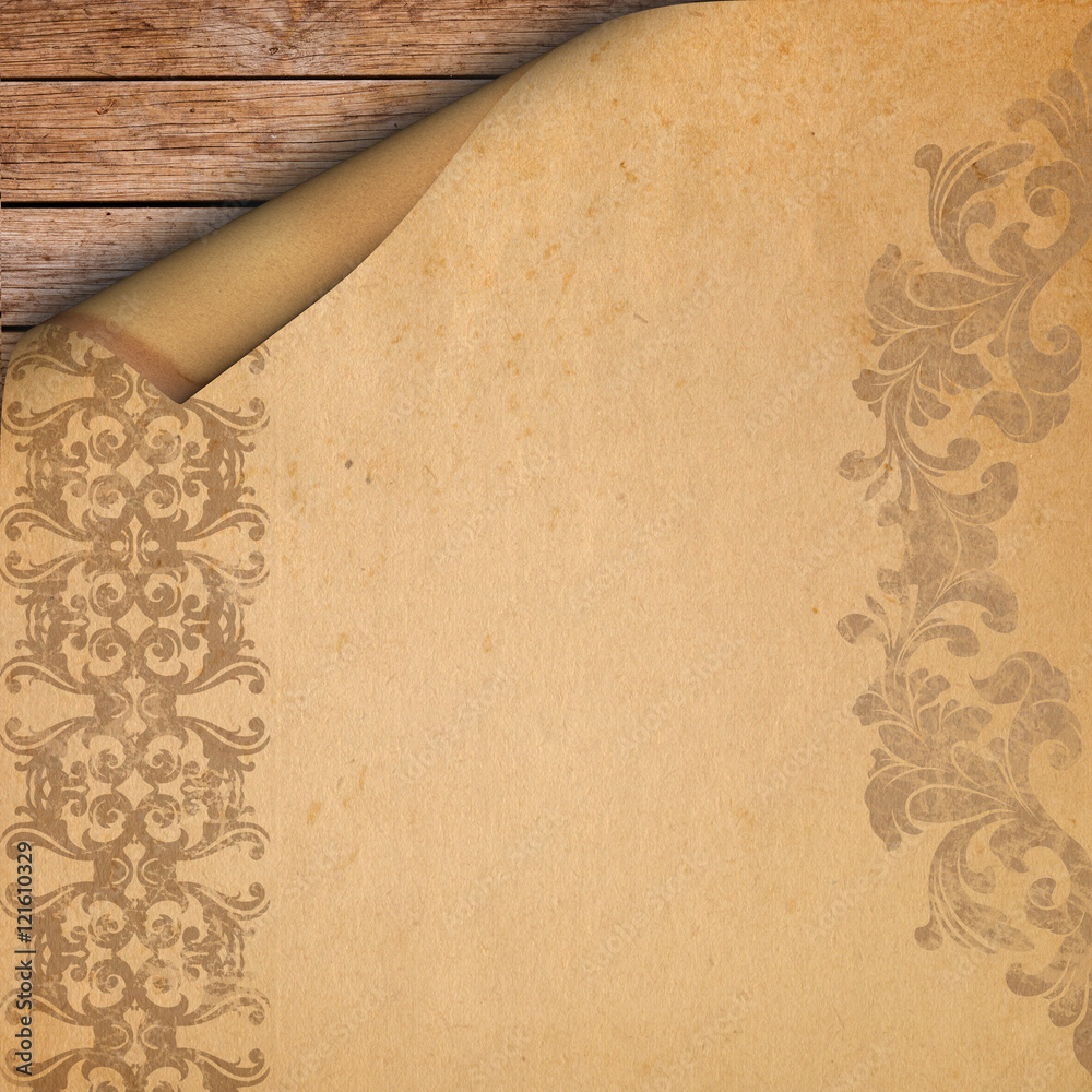 Foto Stock Old paper with vintage patterns and curled corner. | Adobe Stock