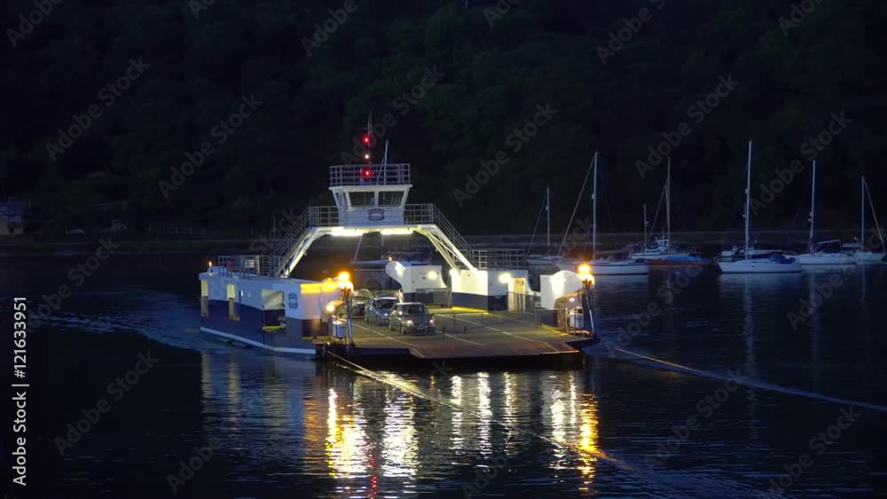 Chain ferry approaches shore at dusk Stock Video | Adobe Stock