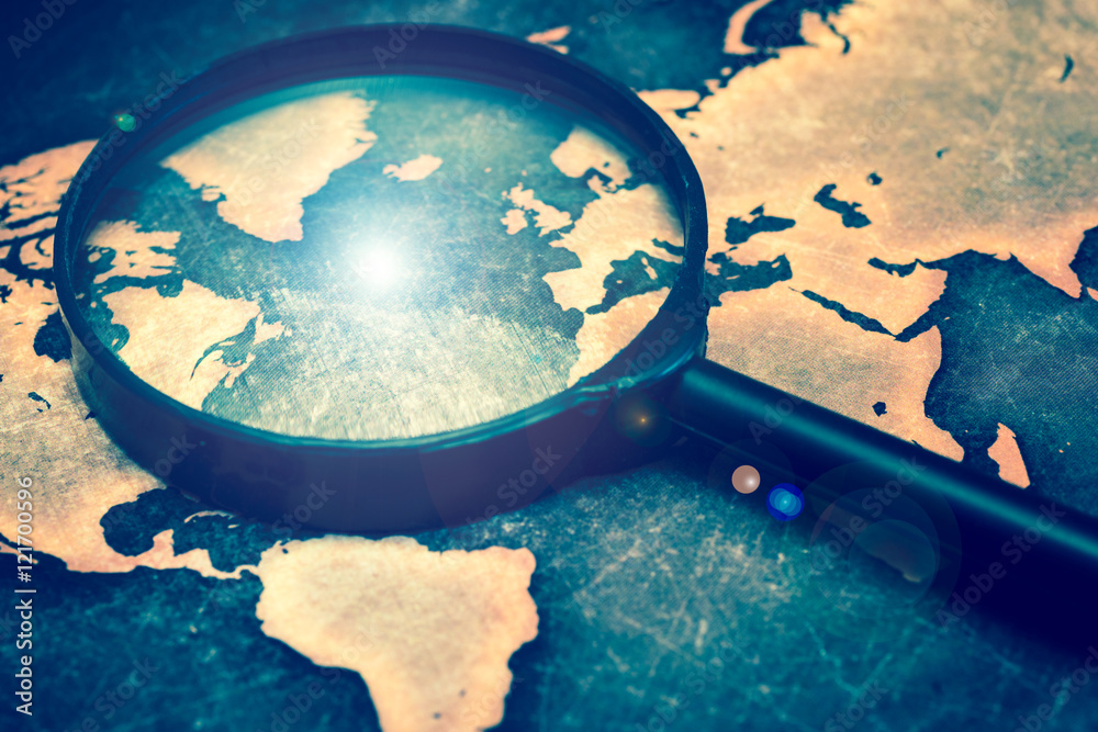 Magnifying lens on grunge world map, with lens flare Stock Photo ...