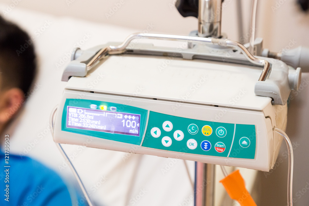 IV infusion pump regulator with patient at background Stock Photo ...