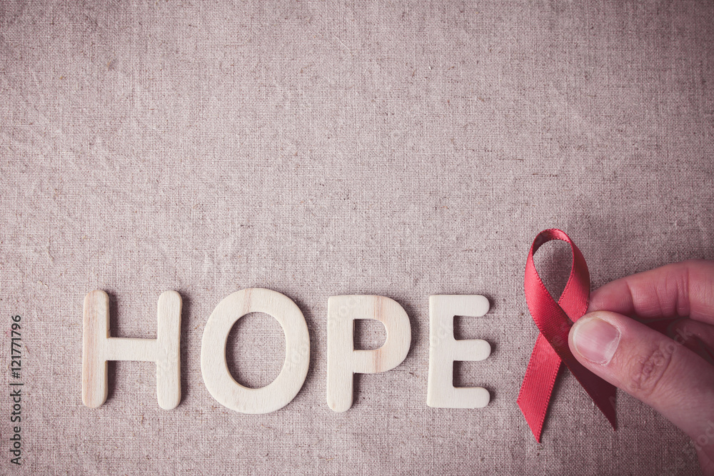 HOPE word with Red Ribbon on toning background, HIV/AIDS, Anosmi Stock ...