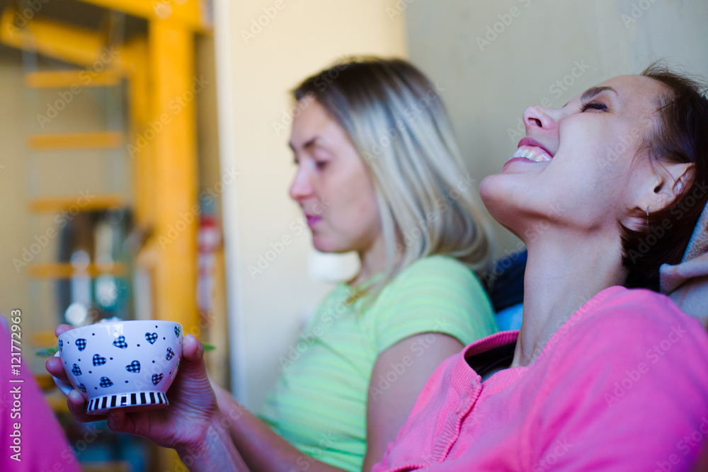 Two friends laughing. Stock Photo | Adobe Stock