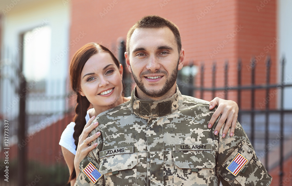 Happy US army soldier with wife on street Stock Photo | Adobe Stock