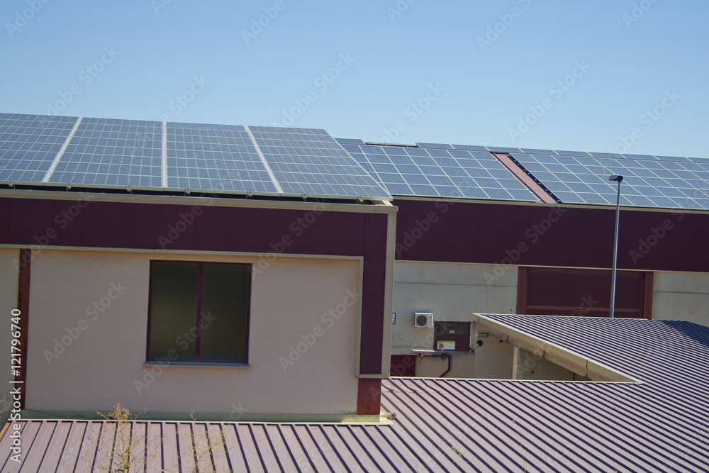Solar panels on a warehouse roof Stock Photo | Adobe Stock