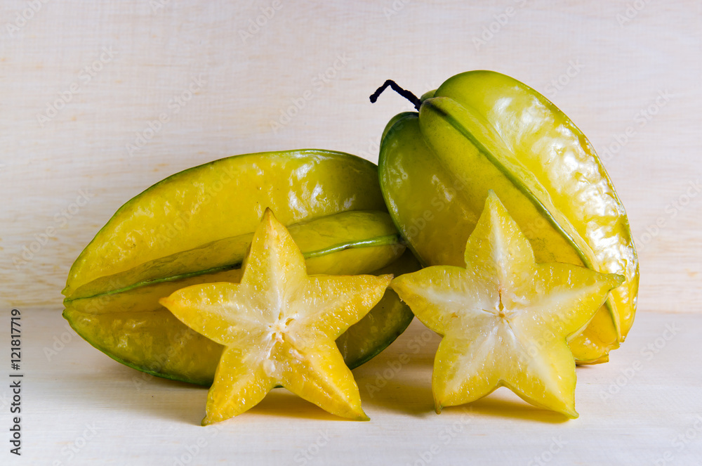 Star apple fruit with half cross section isolated on wooden boar Stock ...