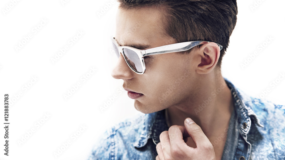 Young handsome man wearing stylish sunglasses Stock Photo | Adobe Stock