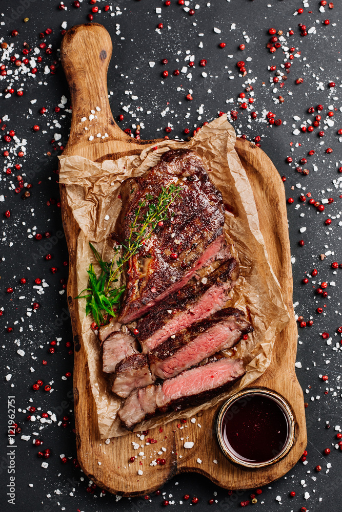 Beef rump steak from marble beef medium rare with sauce on wood Stock ...