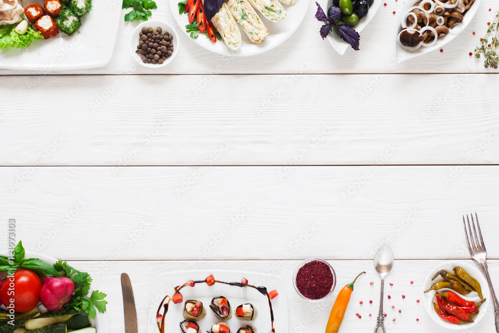 White wooden table with traditional food frame, flat lay. Top view on ...