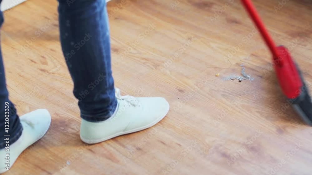 woman with broom cleaning floor at home Stock Video | Adobe Stock