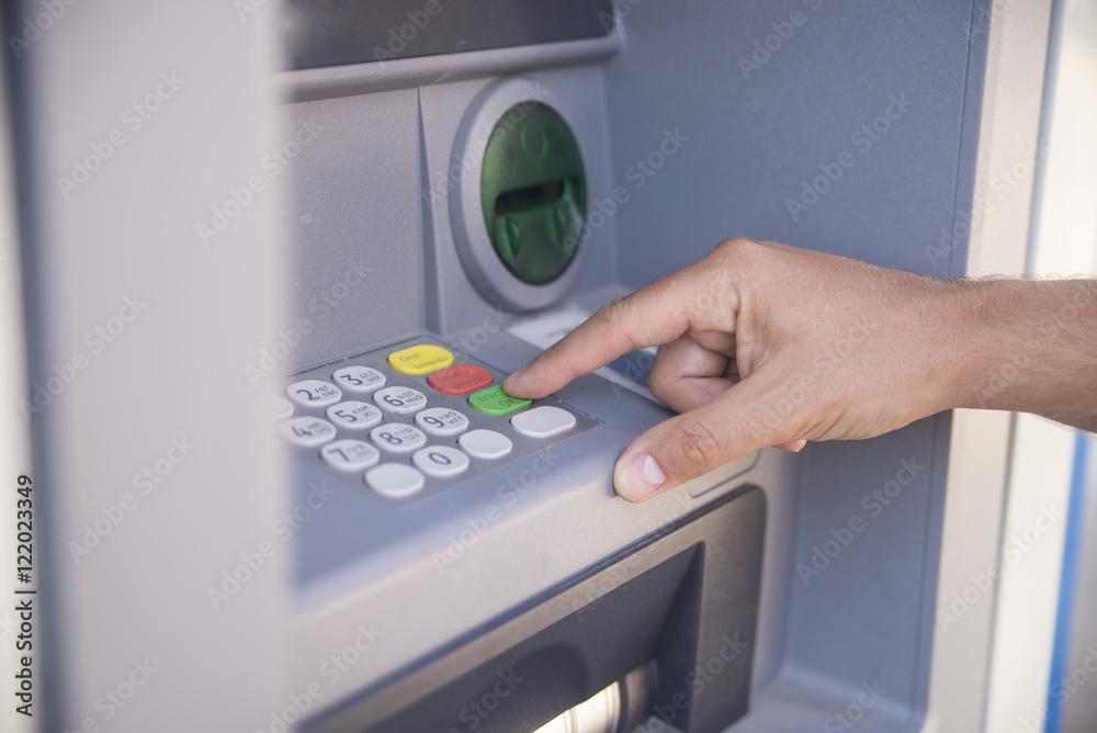 Hand entering personal identification number on ATM dial panel Stock ...