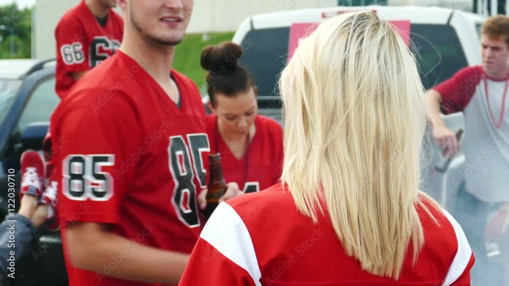 Extensive video series with football fans at a tailgate party, having ...