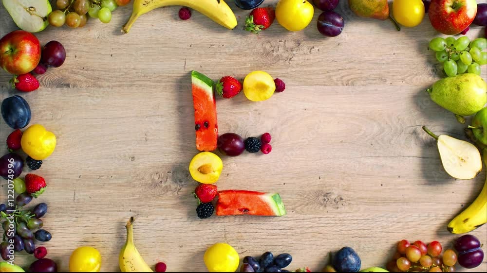 Fruits made letter E. Alphabet on a table. Summer harvest generates ...