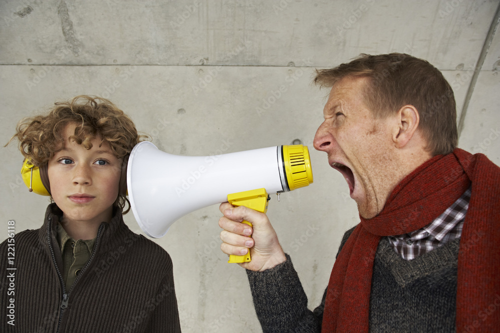 Father and son screaming at each other with megaphone Stock Photo ...