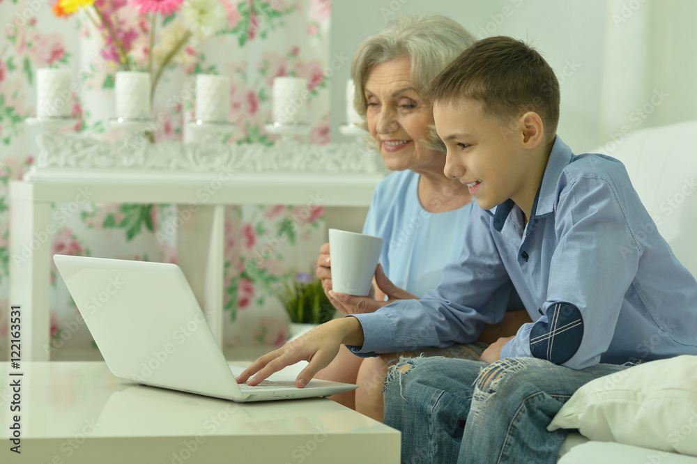 grandmother and boy with laptop Stock Photo | Adobe Stock