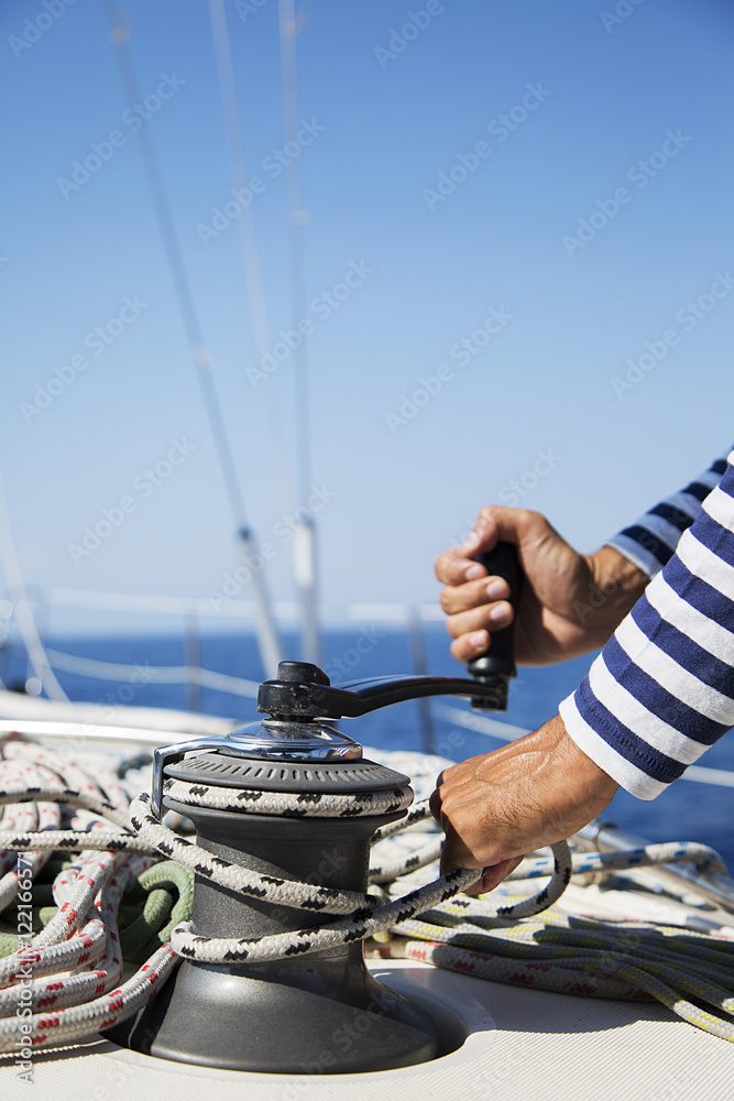 Man in action of pulling rope Stock Photo | Adobe Stock