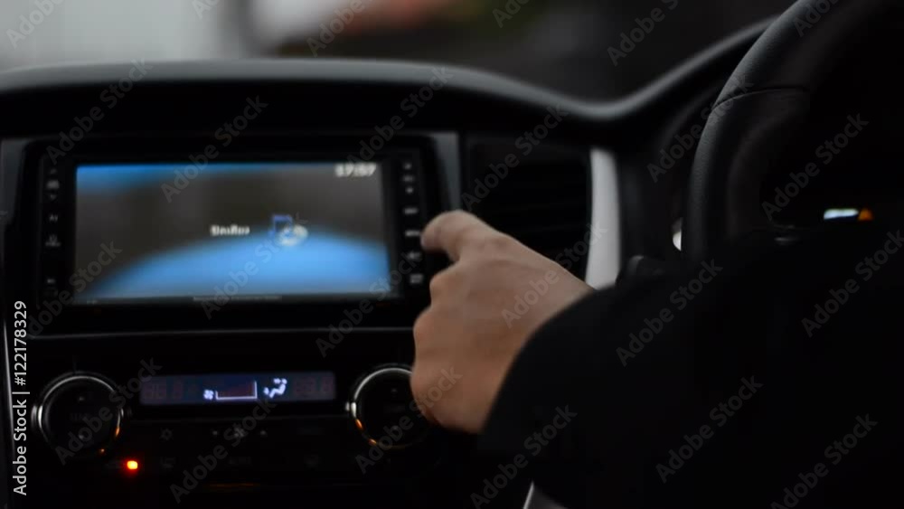 Driver use navigator for nevigate and entertainment in car. Stock Video ...