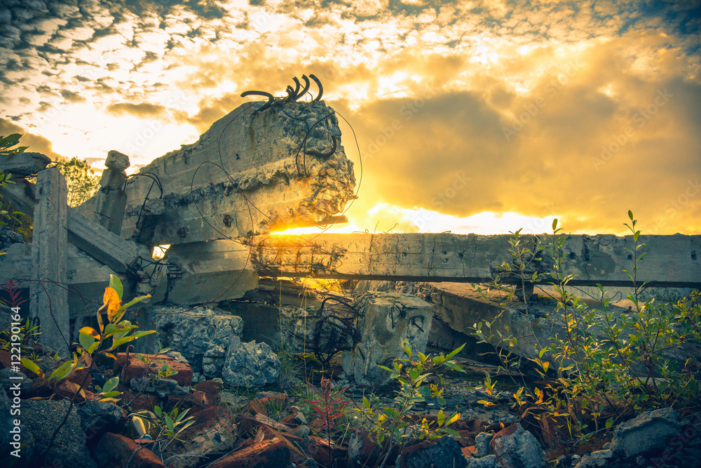 Old ruins of a building.The debris of the damaged building on sunset ...