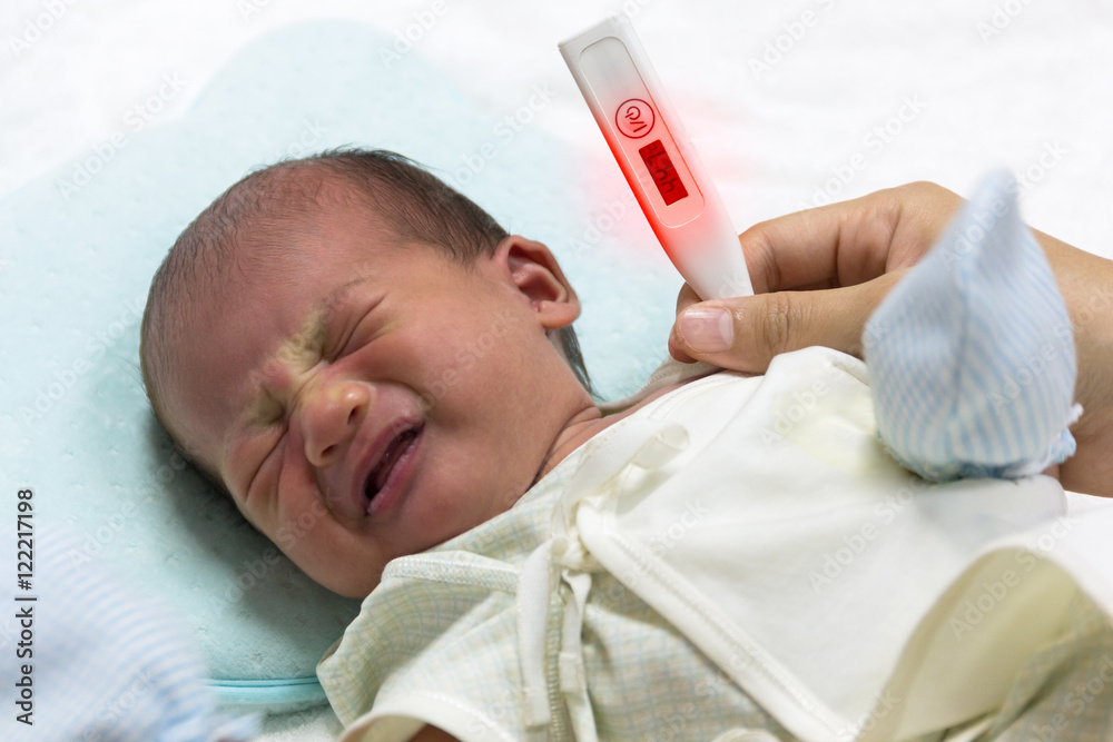 Asian cute new born baby check temperature with digital thermome Stock ...