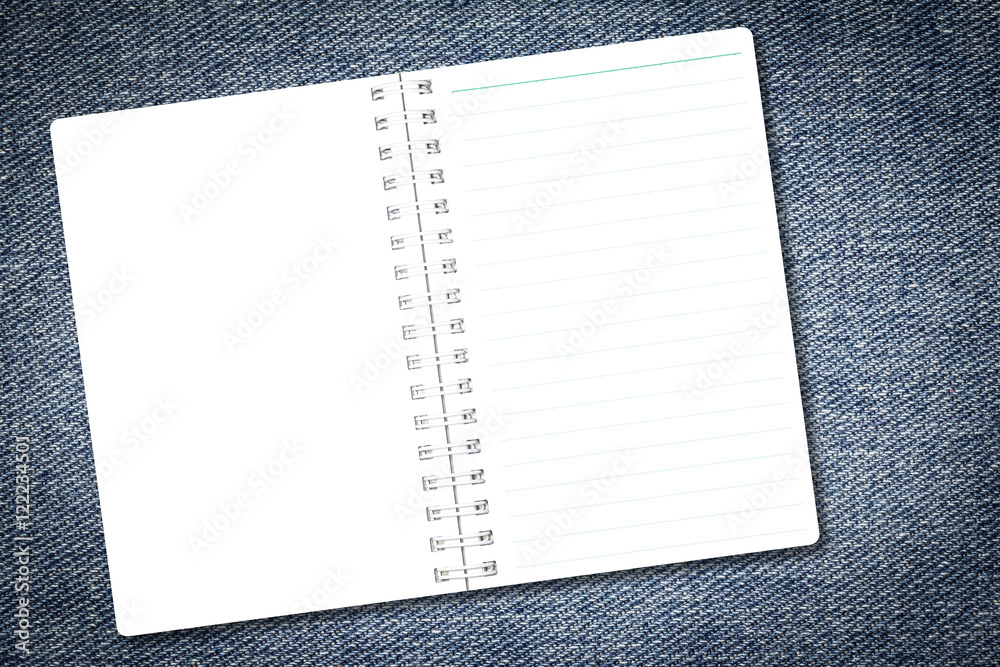Open notebook paper page with line on denim jeans background for design ...