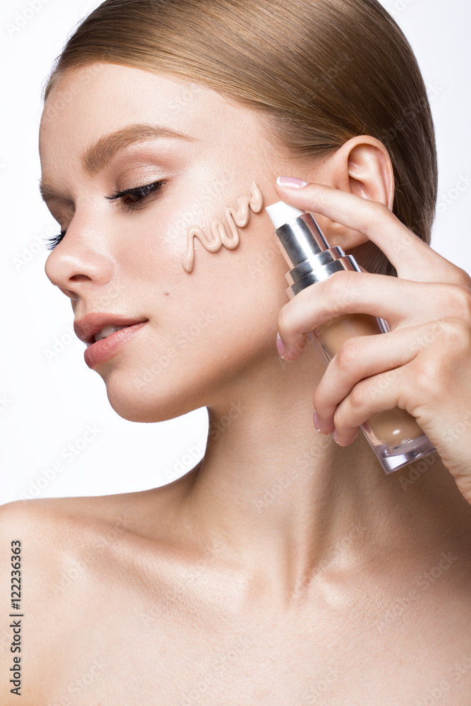 Beautiful young girl with tone cream on her skin. Beauty face. Picture ...
