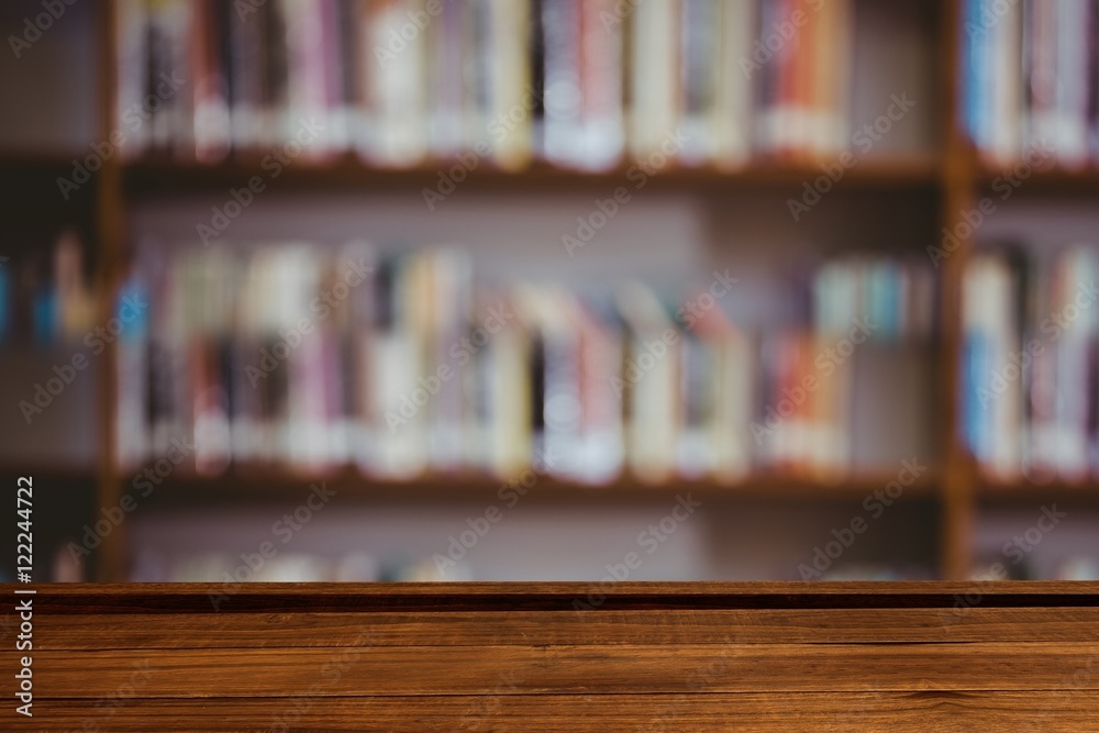 Wooden table with library background Stock Photo | Adobe Stock