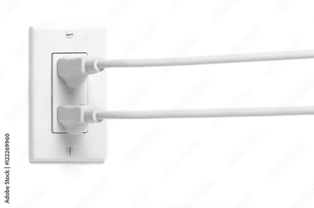 Two electrical extension flex cords plugged into household outlet and ...