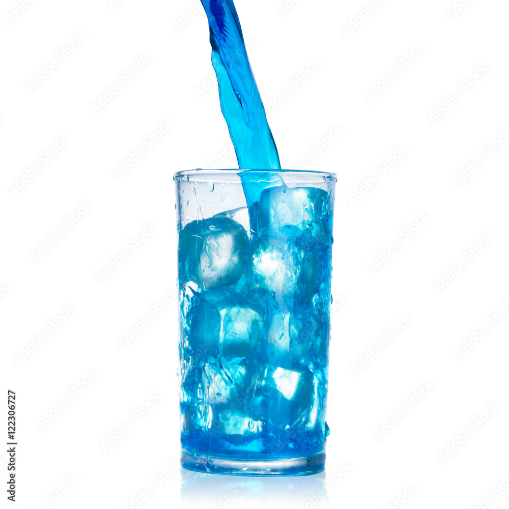 pouring blue water splash into glass isolated on white background with ...