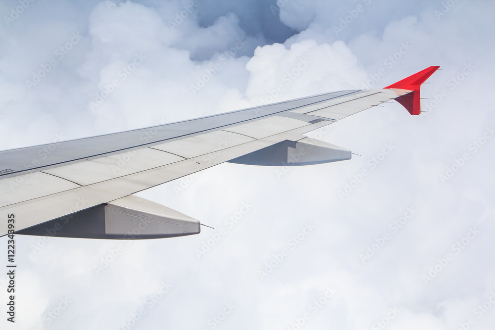 Airplane wing out of a window Stock Photo | Adobe Stock