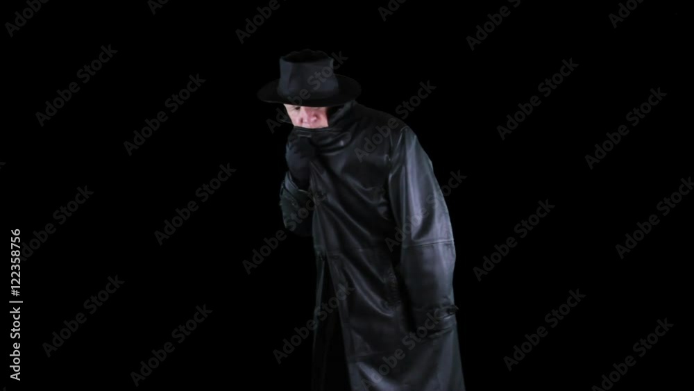 Spy in trench coat sneaking around. Stock Video | Adobe Stock