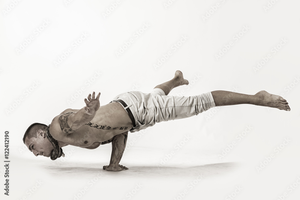 Muscular Shirtless Male Acrobatic Dancer Balancing on Arm and Hand in ...