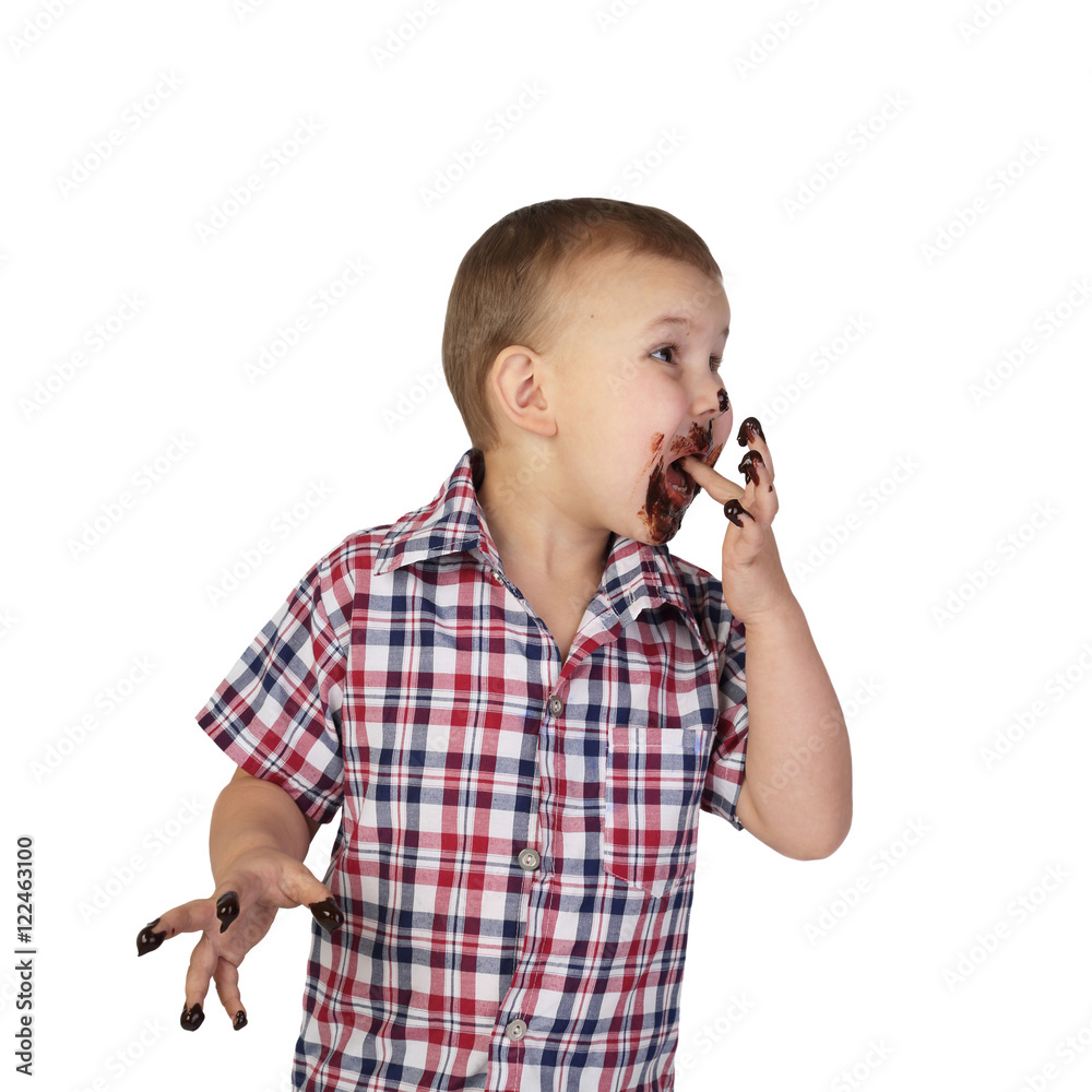 Little boy soiled in chocolate licks fingers isolated on white ...