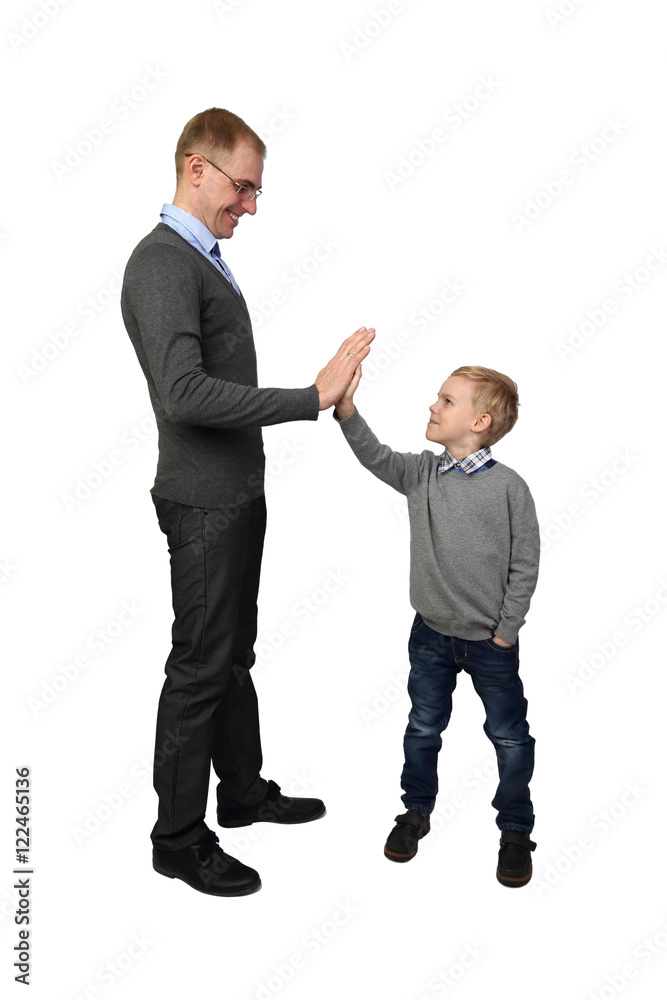 Boy and adult man slapping each other palm isolated on white background ...