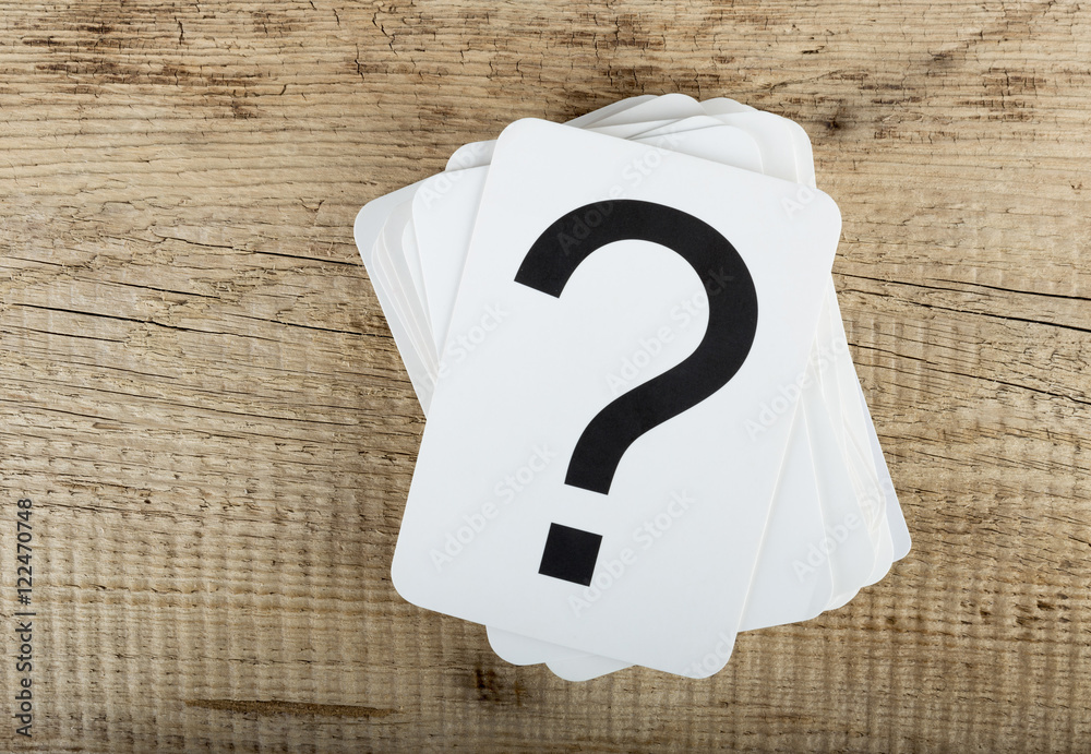 Stack of cards with a question mark on wooden background Stock Photo ...