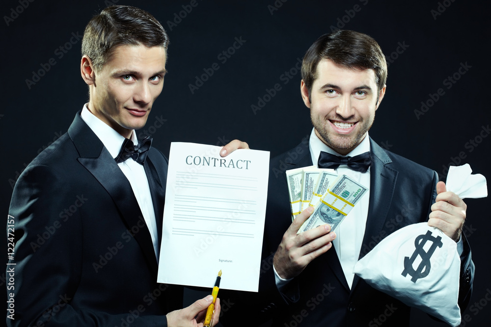 Two presentable men showing contract and money Stock Photo | Adobe Stock